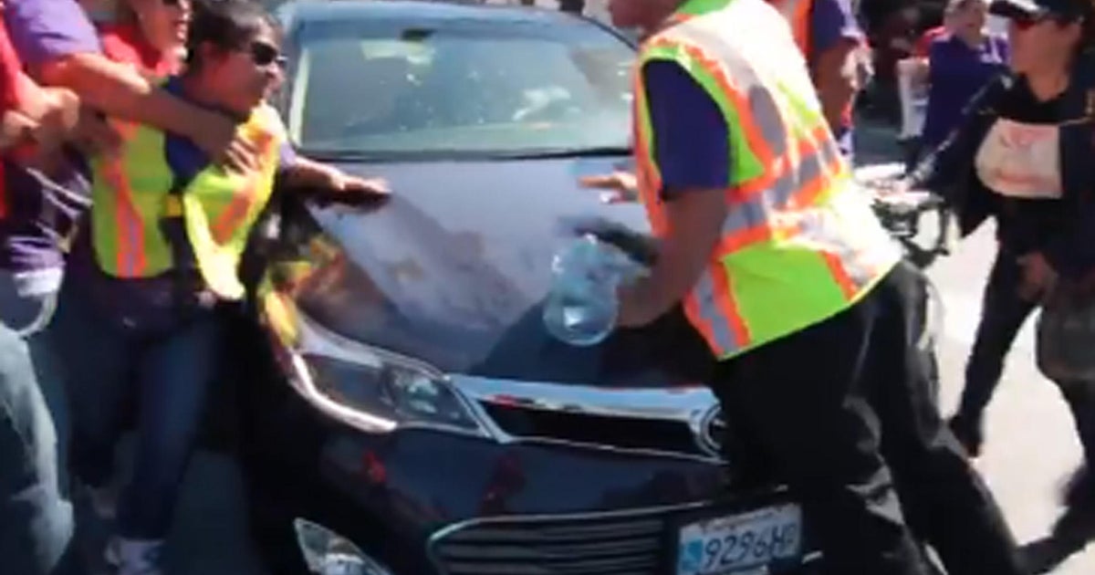Dramatic video shows car driving into immigrant rights rally in ...