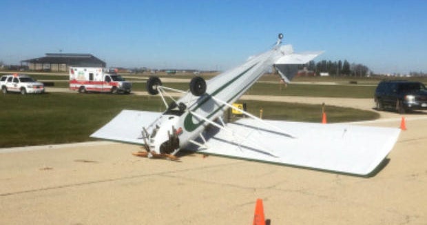 Small airplane flips over while landing at airport in Chicago - CBS News