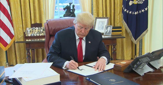 Trump signs sweeping tax bill - CBS News