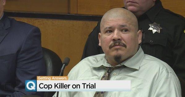 Cop-killing suspect laughs in courtroom outburst, threatens to kill ...
