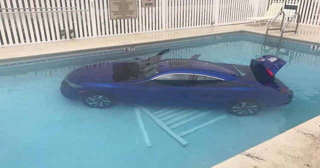 Car rolls into pool with father and daughter inside - CBS News