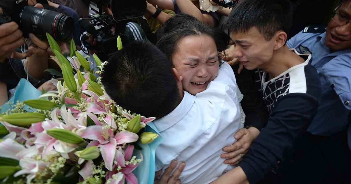 Family reunites with long-lost daughter after 24-year search - CBS News