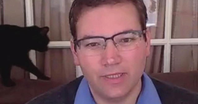 Cat interrupts CBSN interview - CBS News