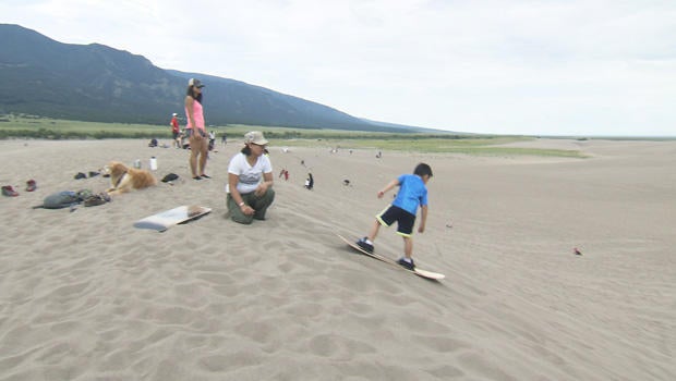 Sandboarding: Hitting slopes of sand - CBS News