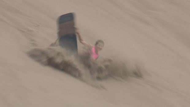 Sandboarding: Hitting slopes of sand - CBS News