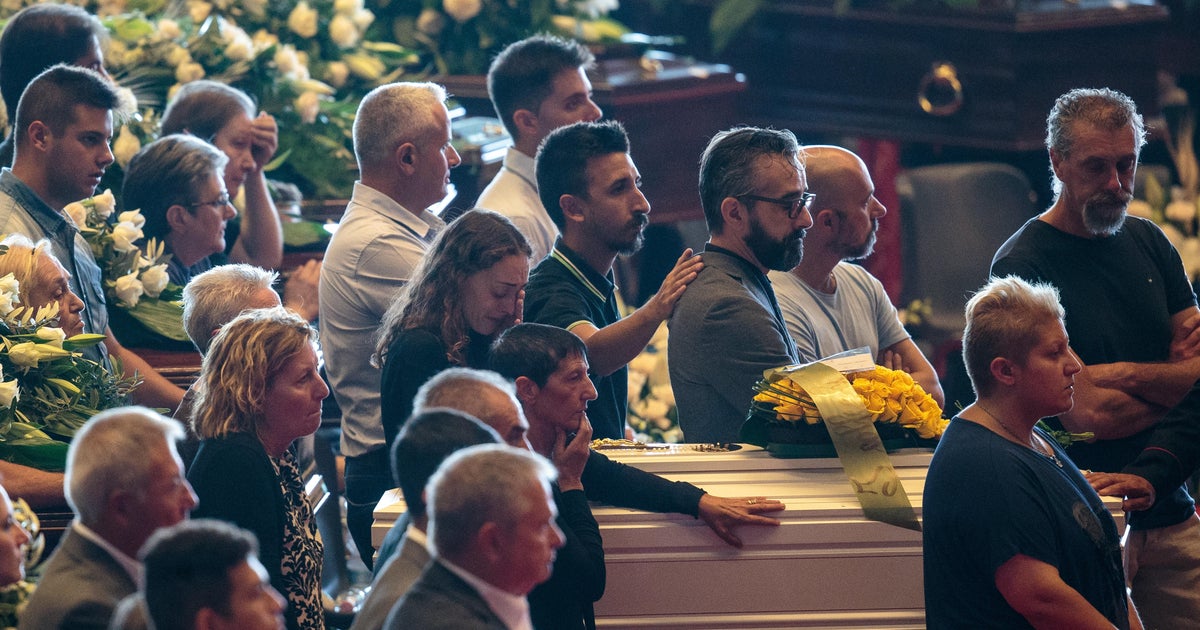 Italy's leader comforts mourners at funeral as bridge toll rises - CBS News