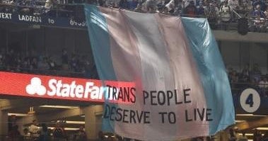 Pro-transgender rights flag unfurled at World Series Game 5 - CBS News