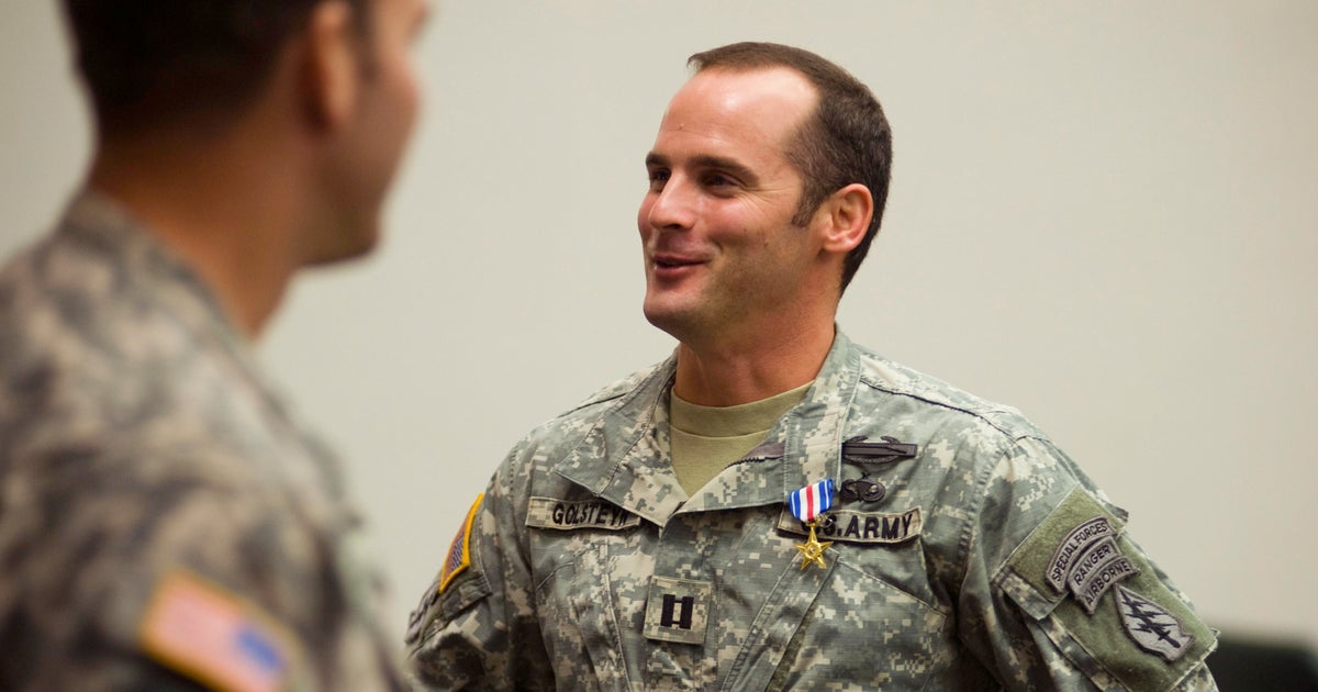 Former Army commando charged with murder of suspected bomb-maker - CBS News