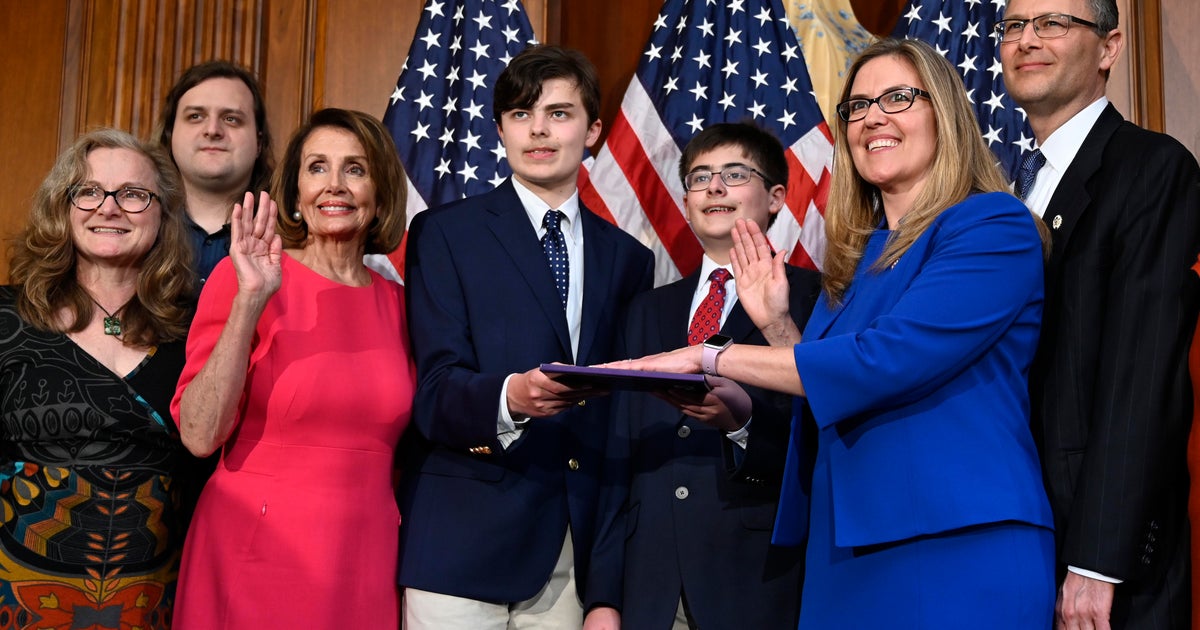 Congresswoman displays transgender pride flag outside office - CBS News