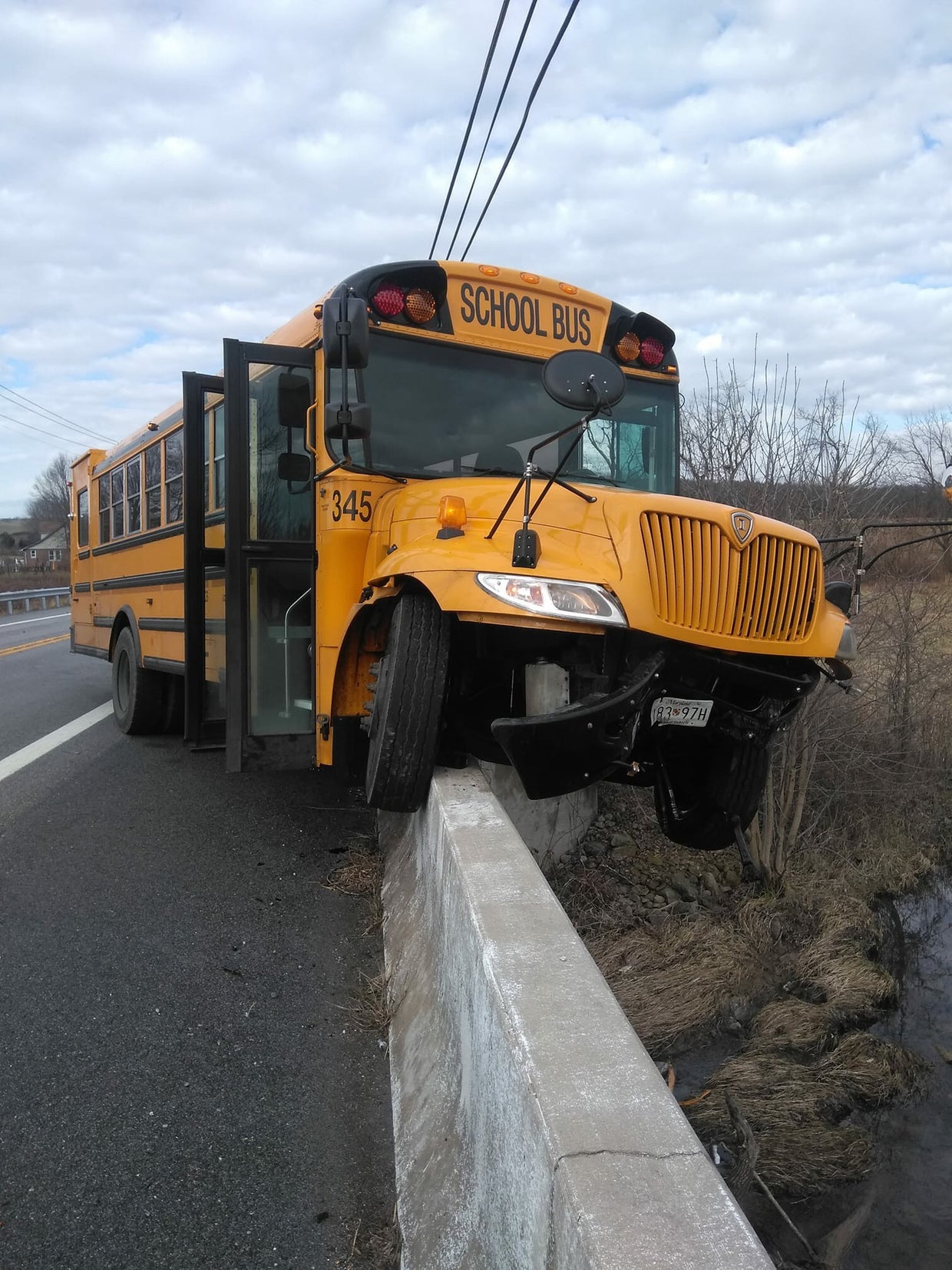 School Bus Hangs Over Concrete Bridge Barrier After Crash - CBS Baltimore