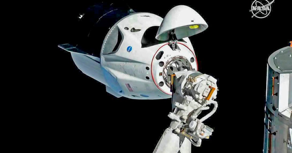 Spacex Crew Capsule With Dummy Aboard Docks With Space Station Cbs