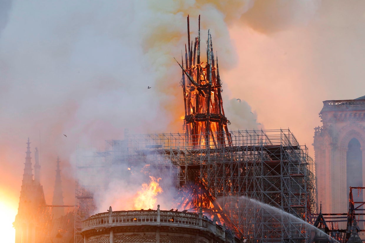 Notre Dame Cathedral fire: Spire and roof collapse as flames break out ...