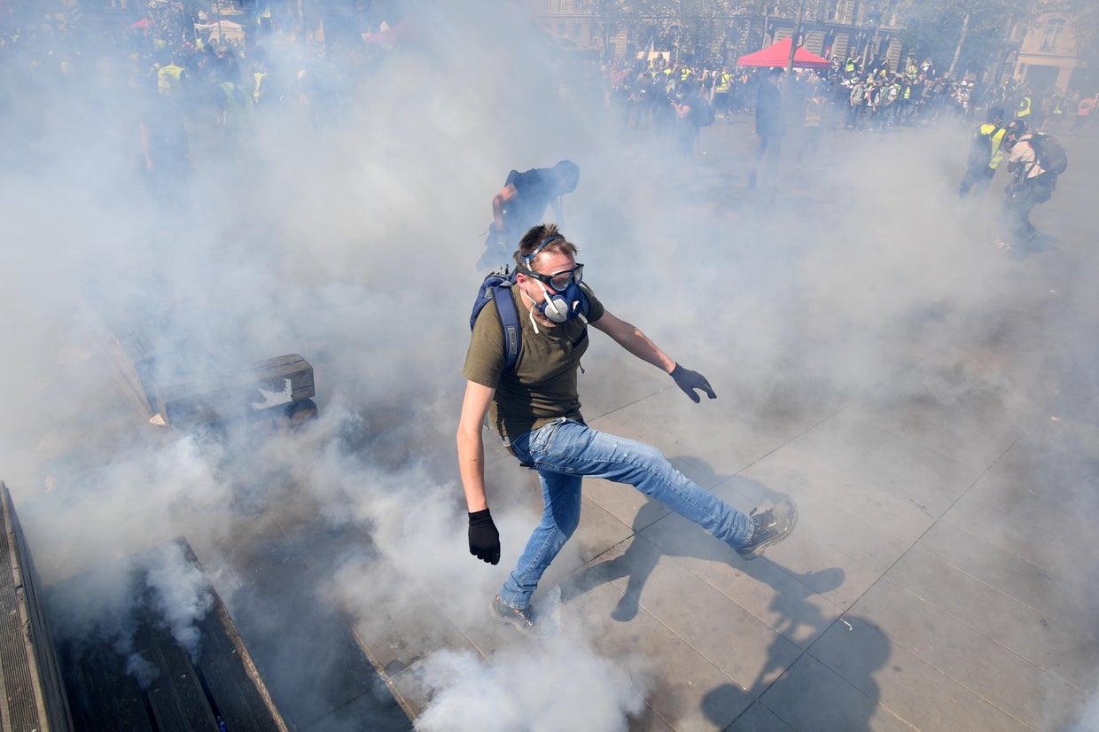 Paris France yellow vest protests: Blazes and tear gas mark yellow vest ...