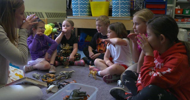 Students learning sign language to support a classmate - CBS News