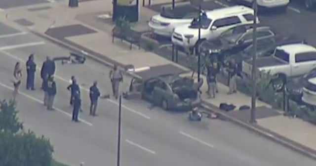 Masked gunman killed in shootout at Dallas courthouse - CBS News