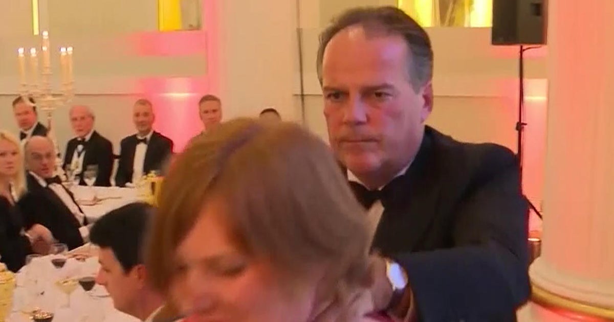Mark Field, MP, seen on video placing hand on Greenpeace protester's ...