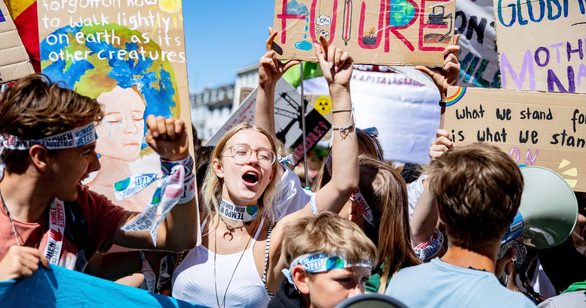 Climate change: Thousands of protesters call for action against climate ...