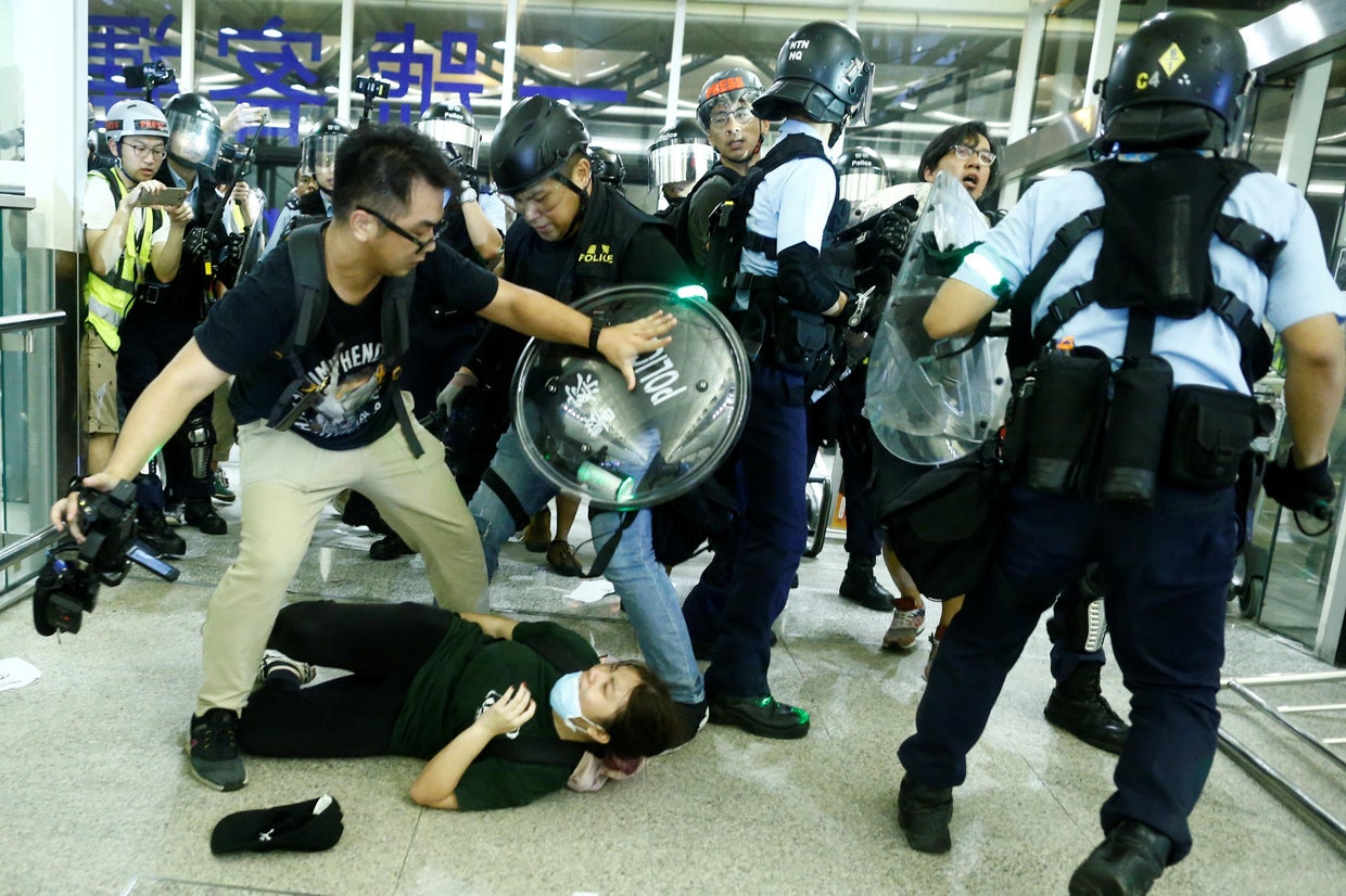 Hong Kong protest: Demonstrators clash with riot police and force ...