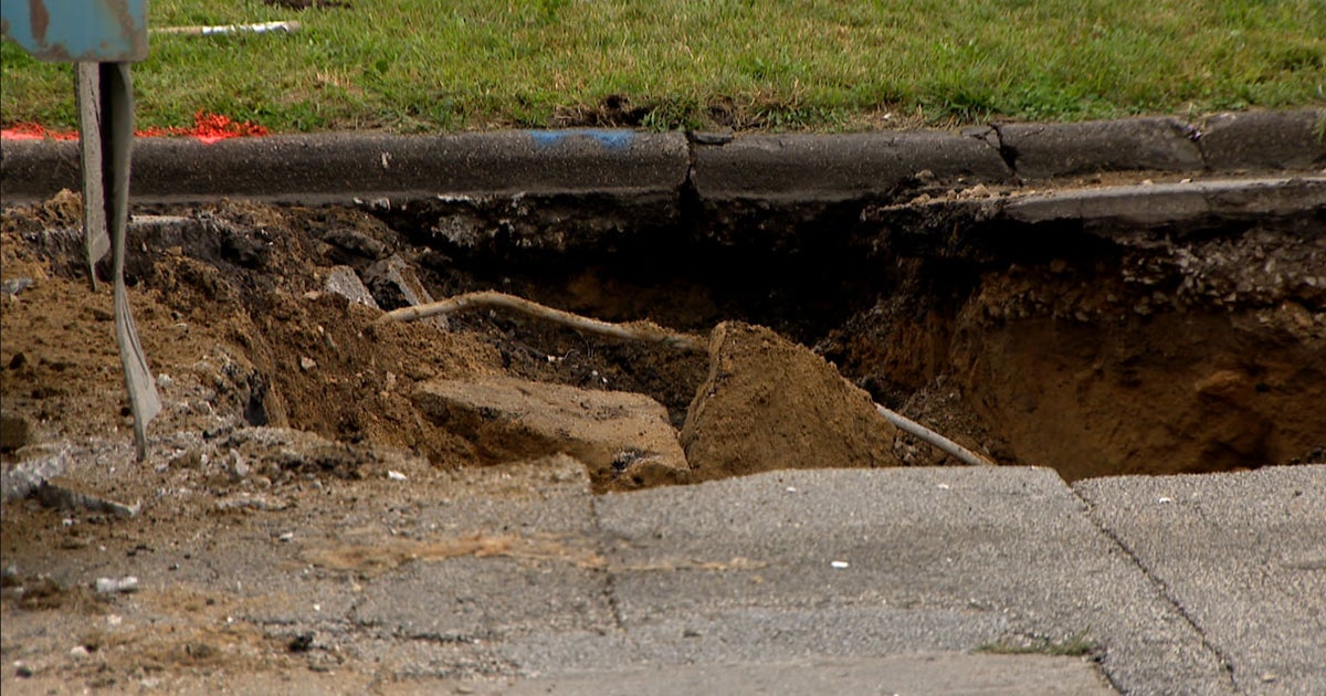 Crews Work To Repair Sinkholes In Grand Crossing Neighborhood - CBS Chicago