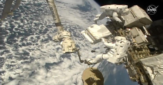 Spacewalk: Astronauts replace coolant pumps on $2 billion cosmic ray ...