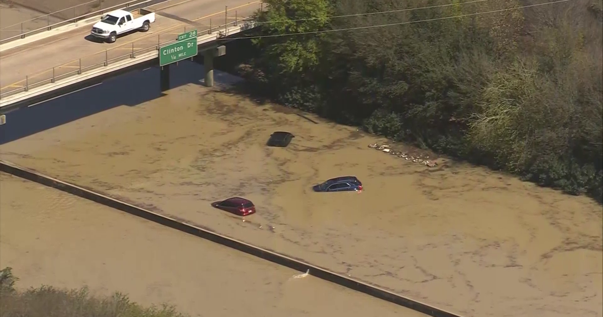 Dramatic rescues unfold after water main break floods Houston - CBS News