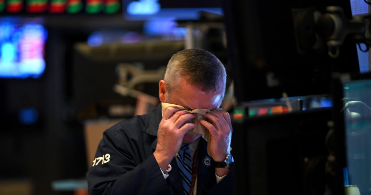 Stocks plunge on COVID-19's spread and Fed's cautious comments - CBS News