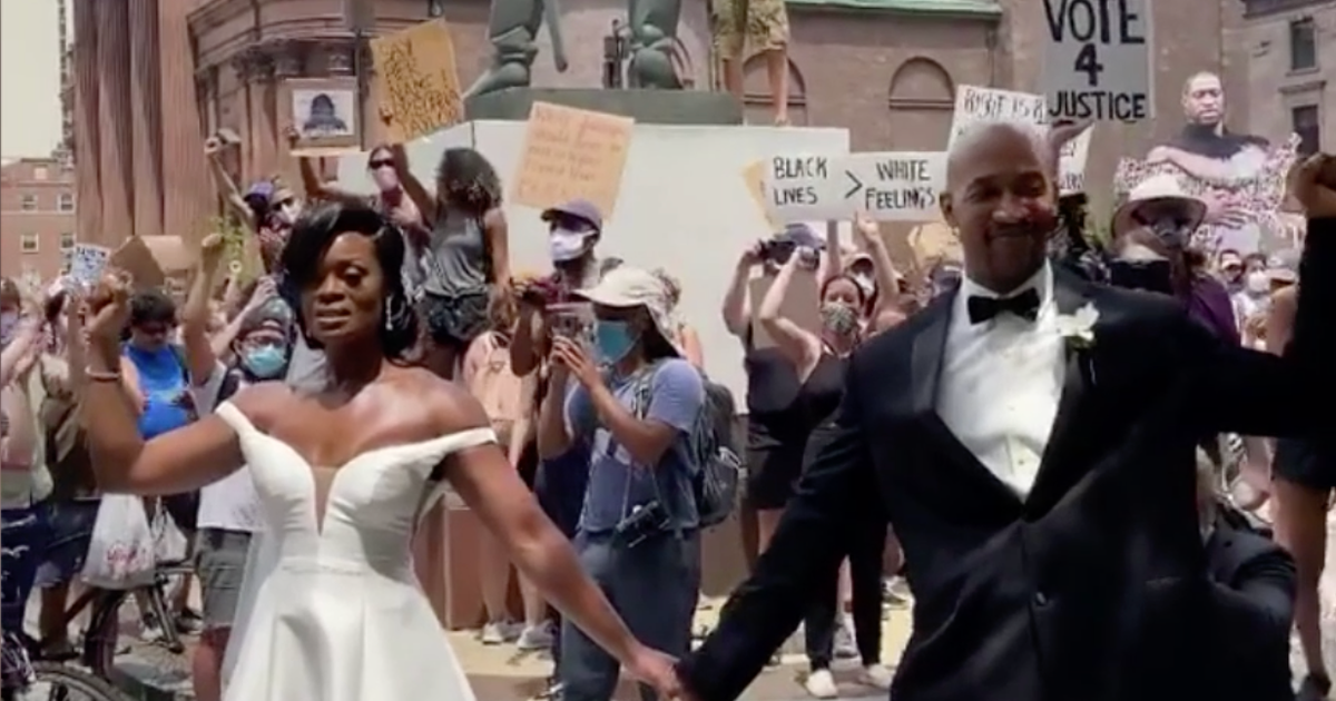 Couple celebrates wedding among thousands of protesters in Philadelphia ...