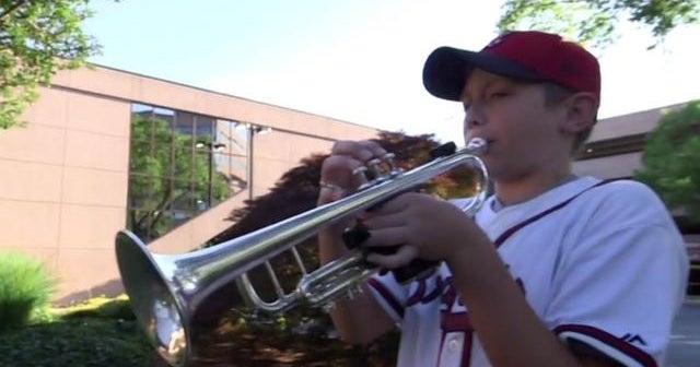 Boy plays trumpet as a tribute to front-line workers - CBS News