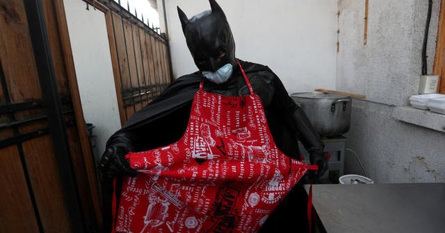 Anonymous Batman hands out free food to the homeless in Santiago, Chile ...