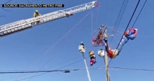 Paragliding Santa Claus rescued after getting caught In power lines in ...