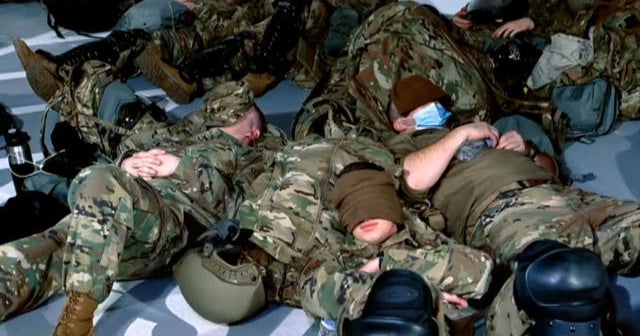 Lawmakers outraged after National Guard moved to parking garage - CBS News