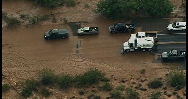 Flash floods put Phoenix area underwater - CBS News
