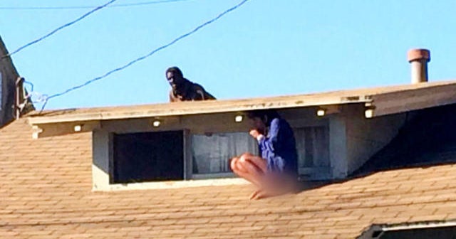 Woman who hid on rooftop to avoid intruder speaks out - CBS News