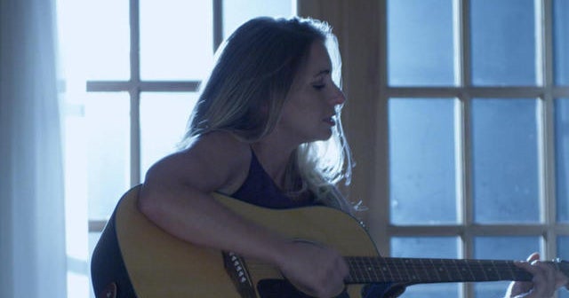 Angela Rose finds solace from trauma in music - CBS News