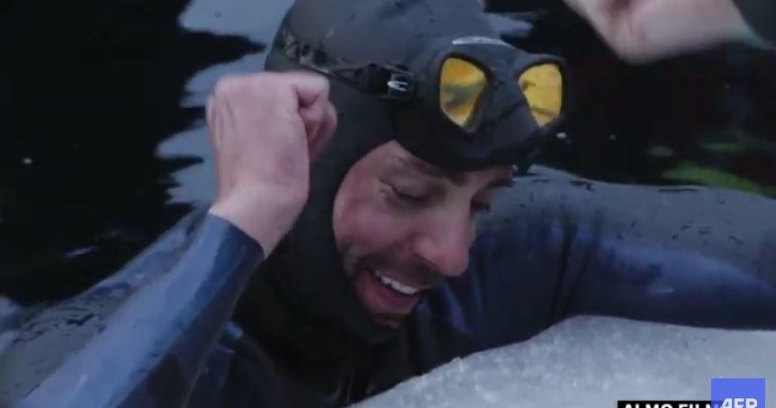 French freediver smashes world record with swim under ice - CBS News