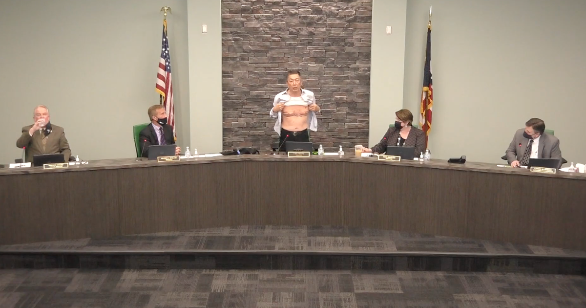 Lee Wong, Asian-American official, lifts shirt at town meeting to ...