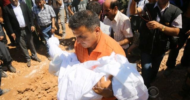 World watches as iconic Syrian migrant boy laid to rest - CBS News