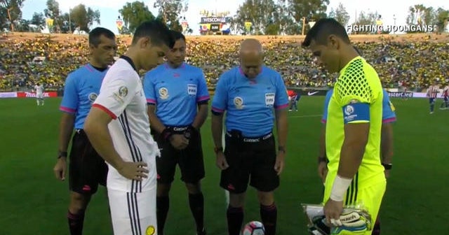 Watch: Coin toss lands right on the edge - CBS News