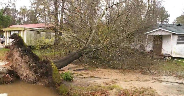 South cleans up after deadly storm system - CBS News