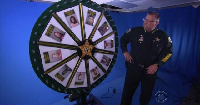 Florida cop looks for suspects with "Wheel of Fugitive" - CBS News