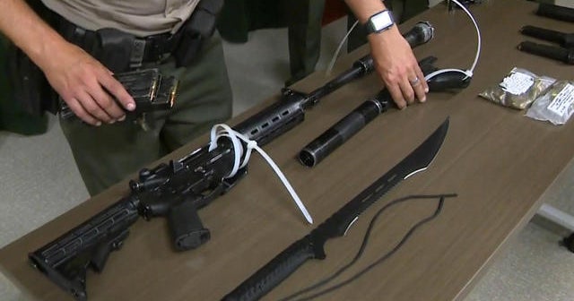 Man carrying weapons cache arrested at train station - CBS News