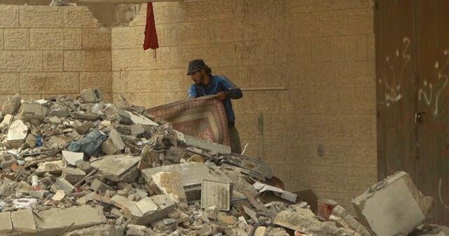 Gaza residents' lives resume with building wreckage from airstrikes ...