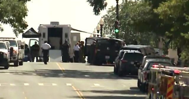 D.C. bomb threat suspect taken into custody following hours-long standoff - CBS News