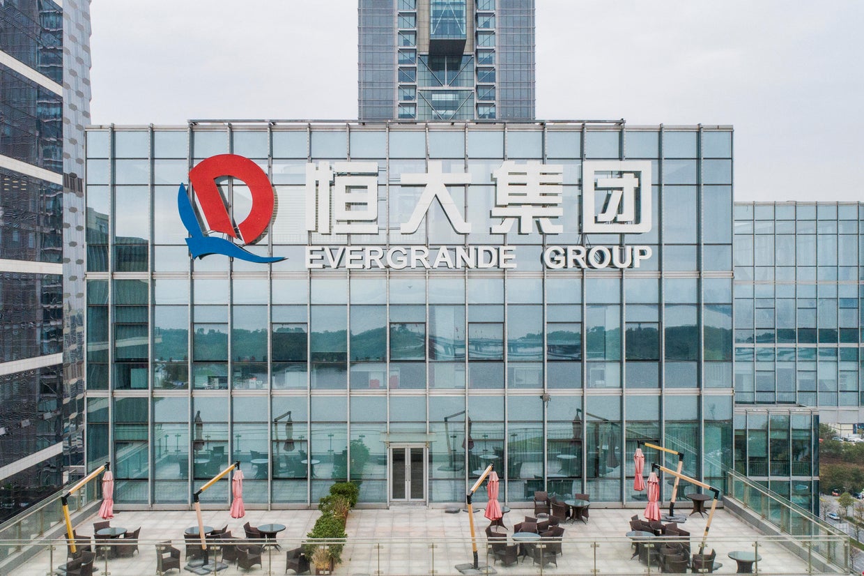 Evergrande defaults on $1.2B in foreign bonds, Fitch says, as China ...