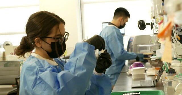 Labs across U.S. test for COVID Omicron variant - CBS News