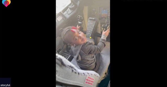 Pilot lets little girl who loves airplanes sit in the cockpit - CBS News