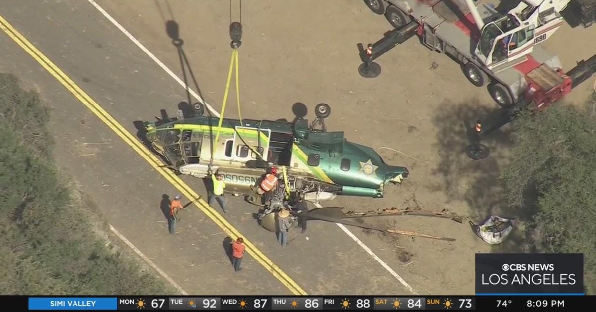 Crane hoists up wreckage of LASD helicopter that crashed Saturday in ...