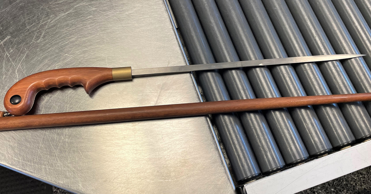 Surprise find in cane at Boston's Logan airport: a long blade - CBS News