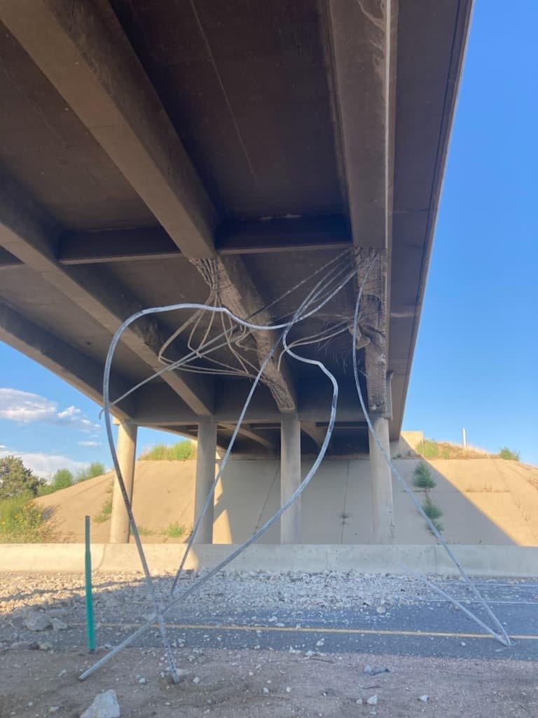 Excavator being hauled by semi crashes into bridge on I-25 in northern ...