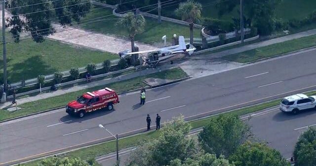 Video shows plane crashing through fence and into driveway in Florida ...